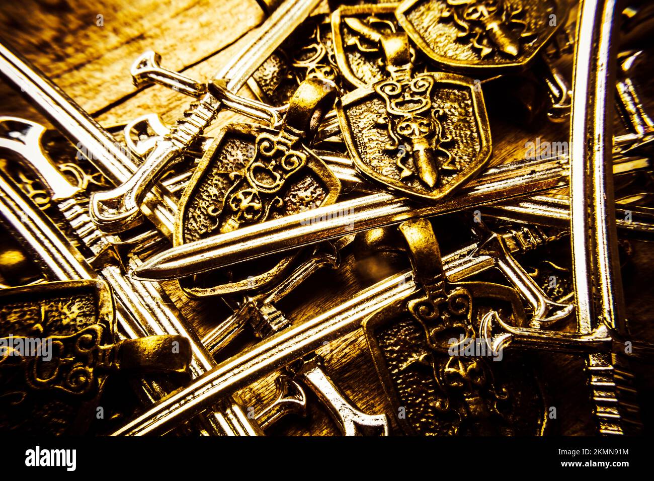 Bronze shields and steel swords jewelry close-up. Shields and swords ...
