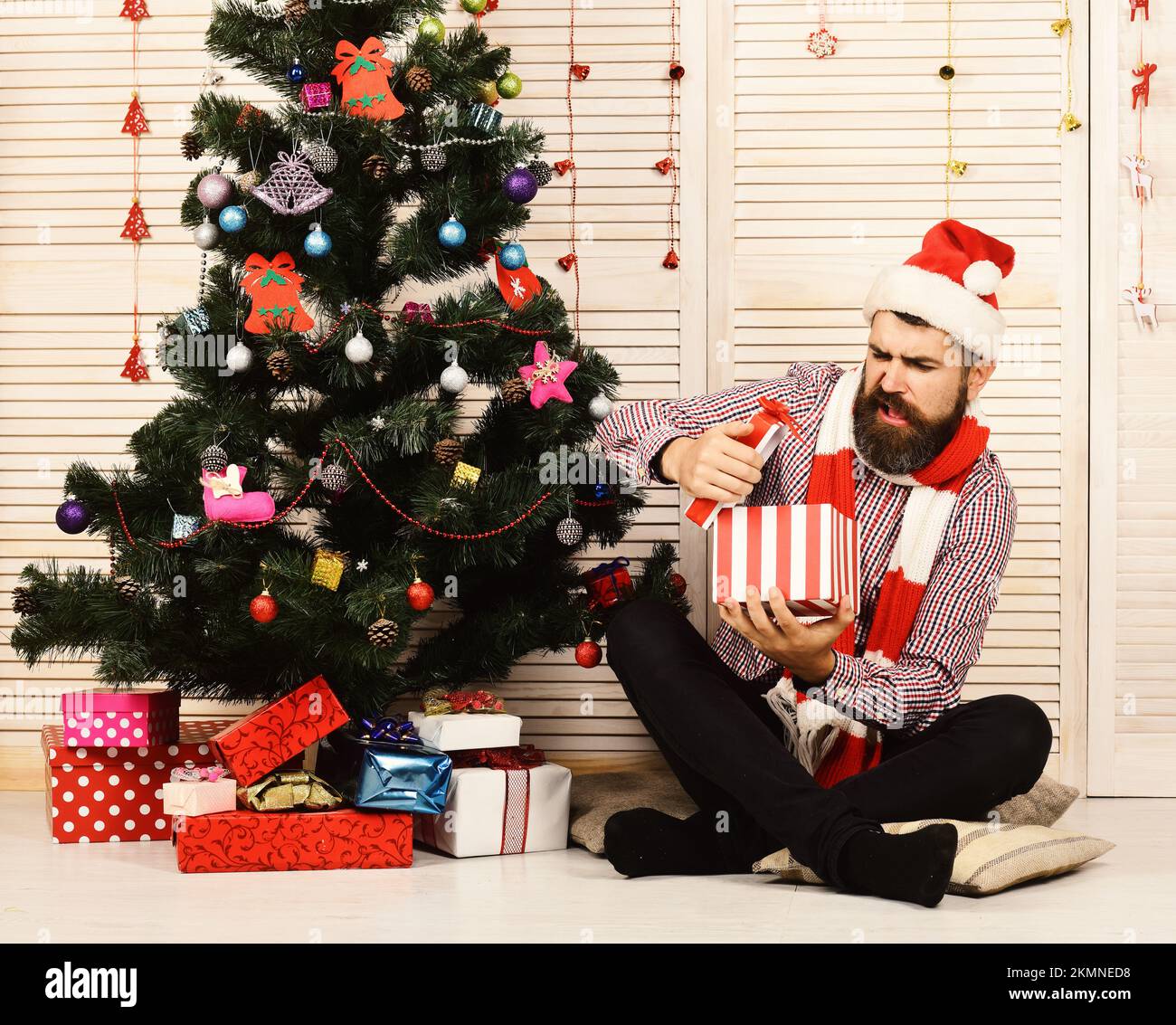Santa Claus with disappointed face on red garlands background Stock ...