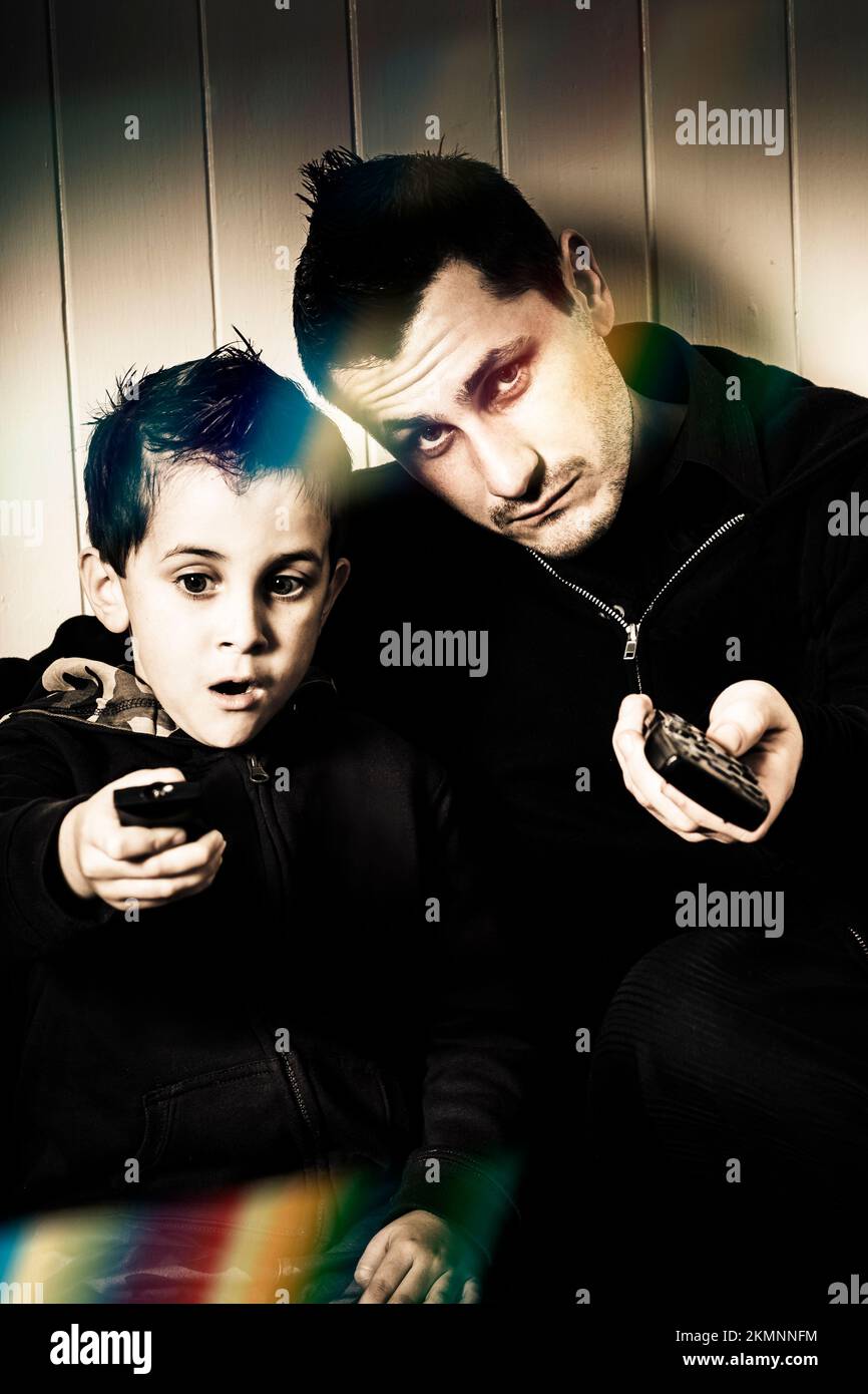 Light leaks picture of a dad and his little boy fighting for control ...