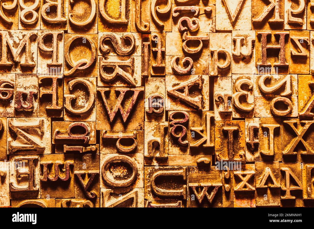 Historic background art on a alphabetized wall of rustic typesetting ...