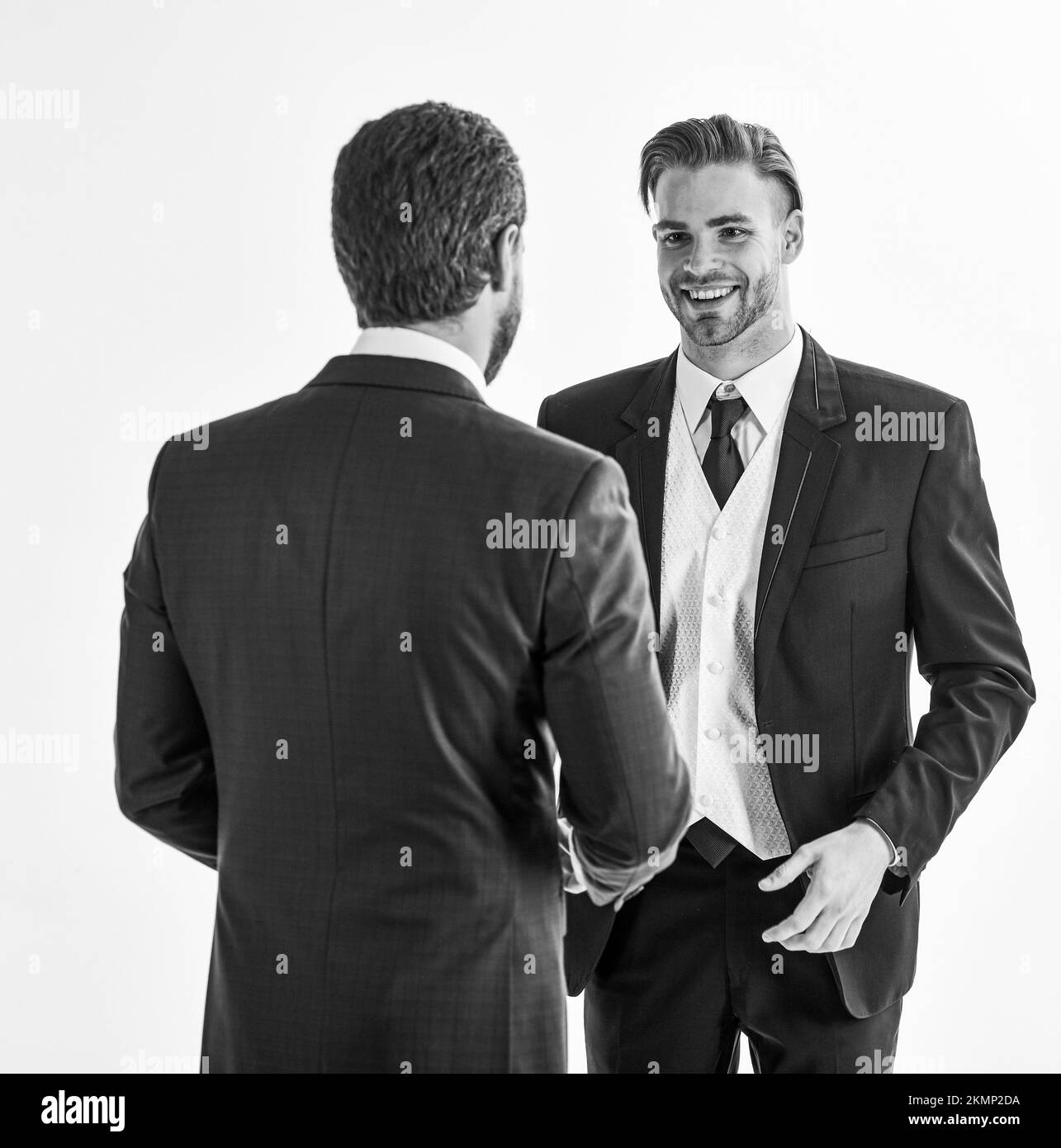 Men in suits or business partners speaking on white background Stock ...