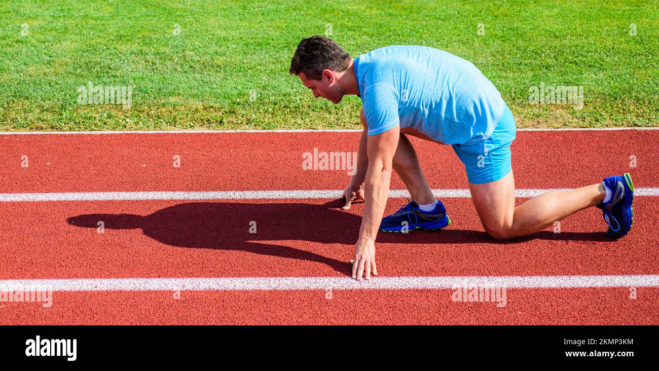 Make effort for victory. Adult runner prepare race at stadium. How to ...