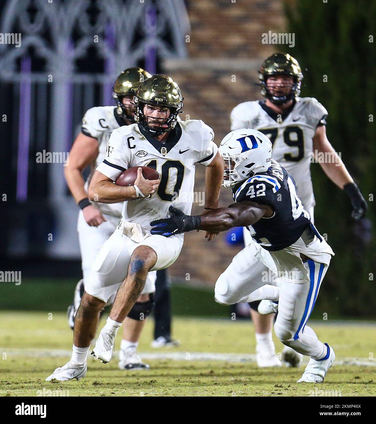 November 26, 2022: Wake Forest junior Sam Hartman (10) scrambles away ...