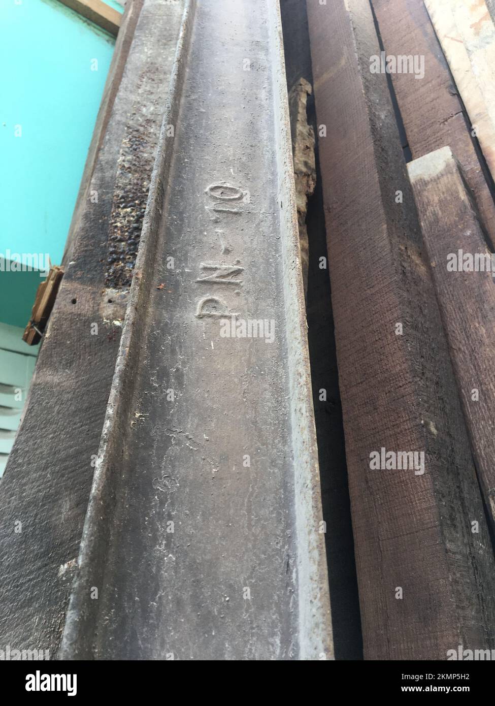 Close-up of a vintage I-beam or C-channel with the embossed letters and ...