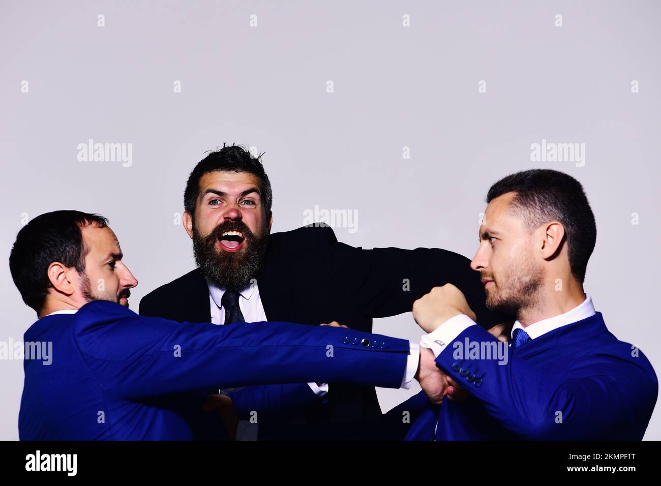 Businessmen with serious and angry faces in formal suits Stock Photo ...