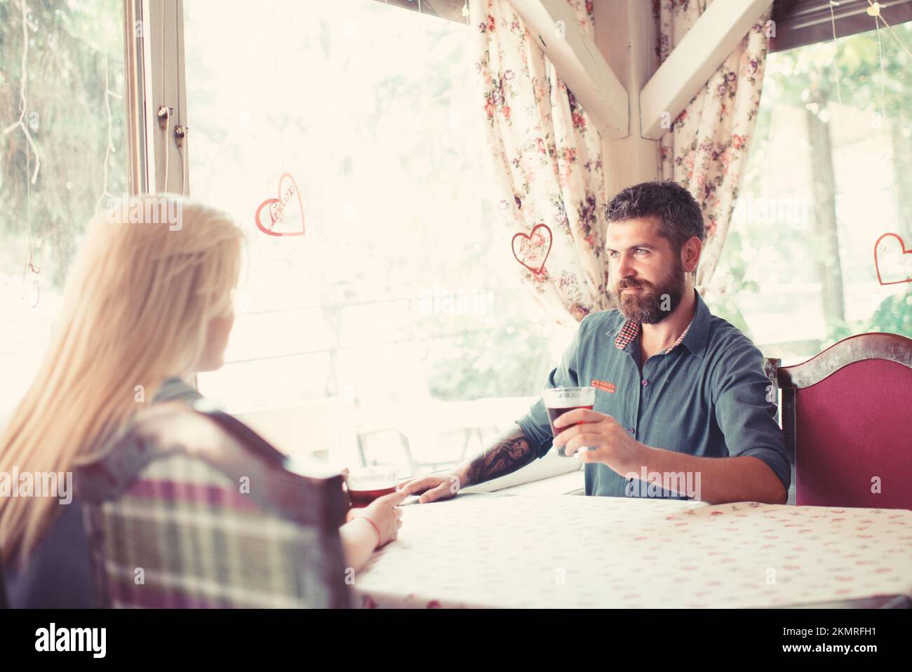 Couple in love drinks wine in cafe or restaurant Stock Photo - Alamy