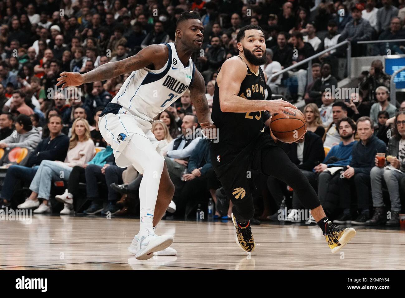 Toronto Raptors' Fred VanVleet (right) drives past Dallas Mavericks ...