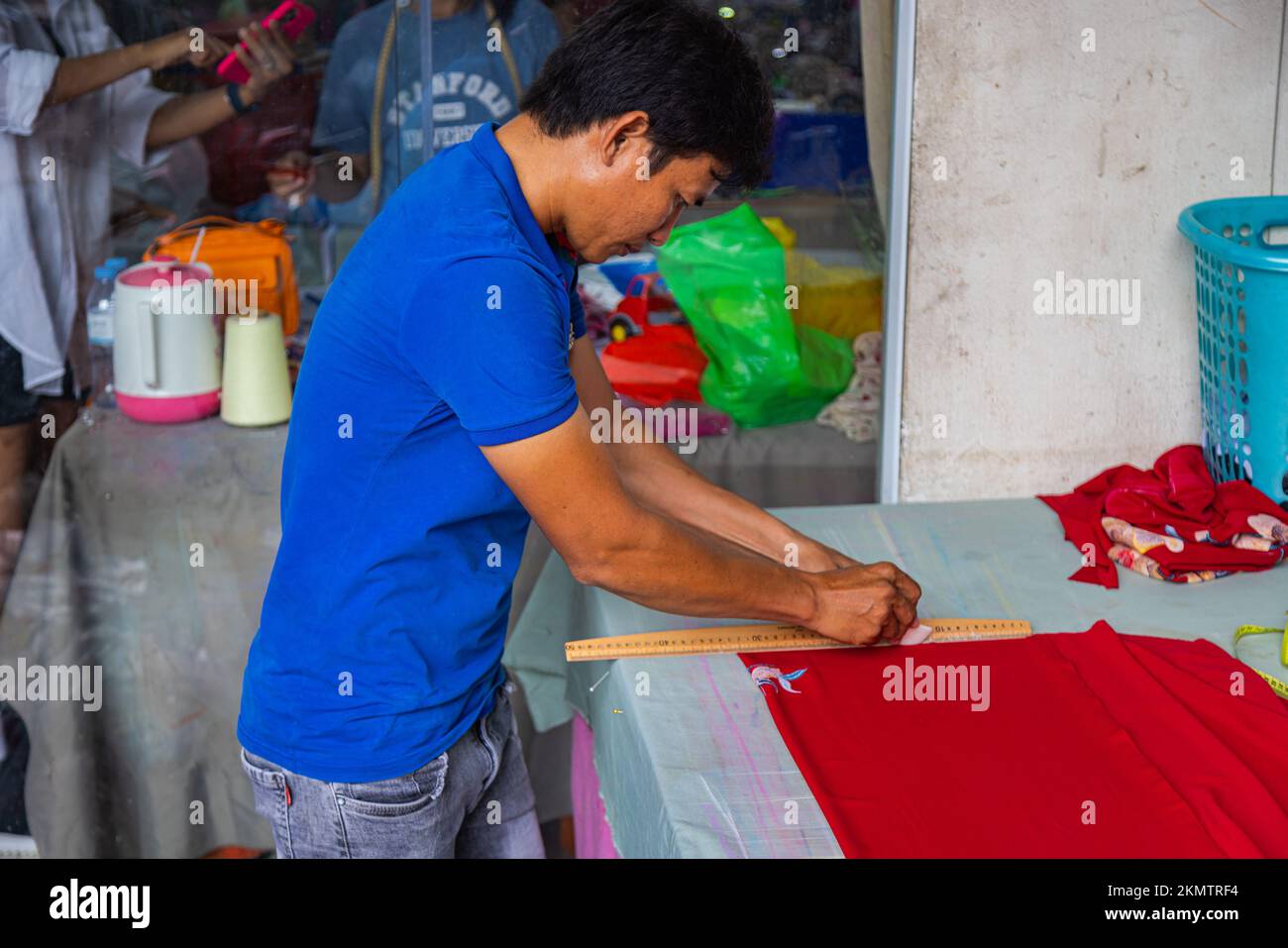 Ho Chi Minh City, Vietnam - November 8, 2022: In a small tailor shop in ...
