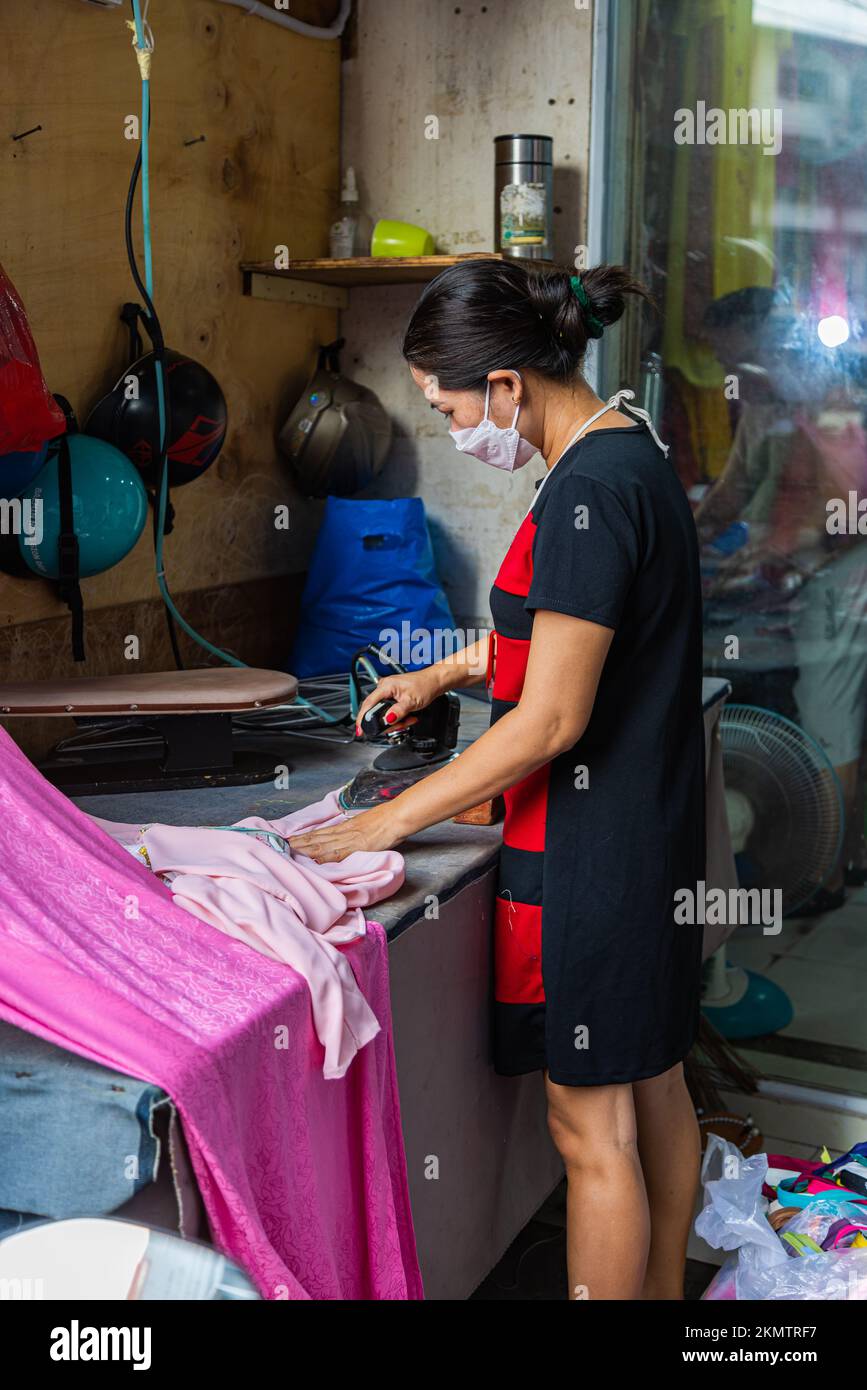 Ho Chi Minh City, Vietnam - November 8, 2022: In a small tailor shop in ...