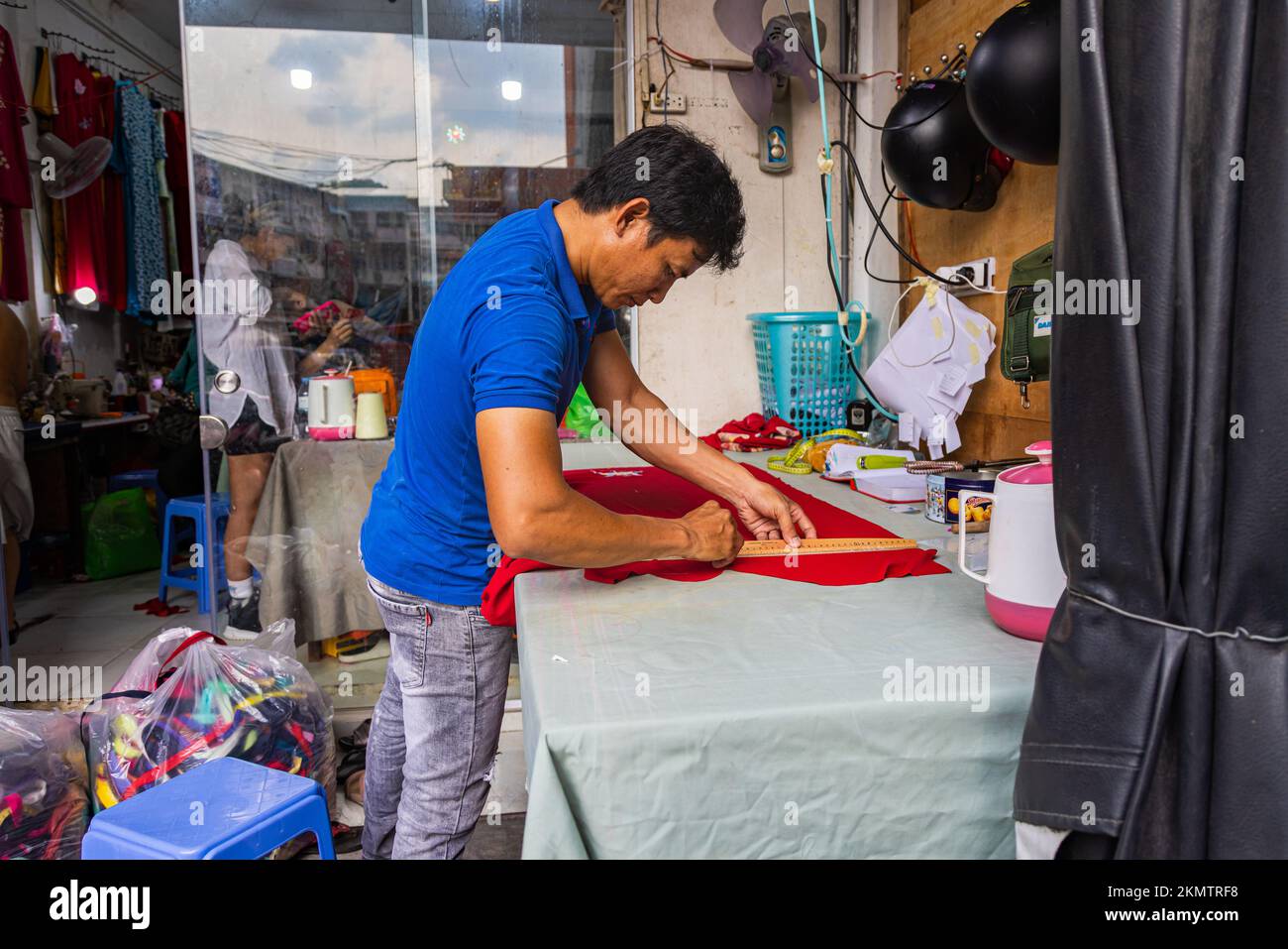 Ho Chi Minh City, Vietnam - November 8, 2022: In a small tailor shop in ...