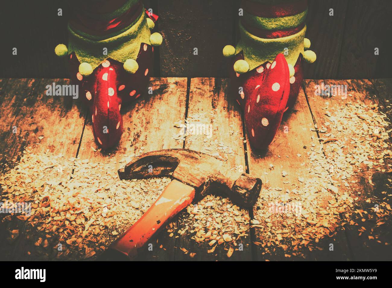 Artistic Christmas art on the shoes of a elf standing under hammer and ...