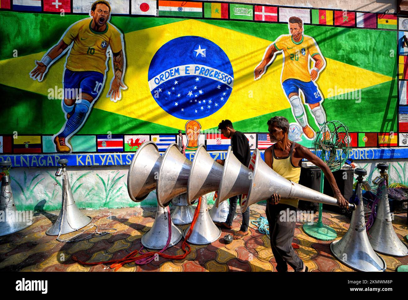 People seen working in front of a wall graffiti of Brazilian football ...