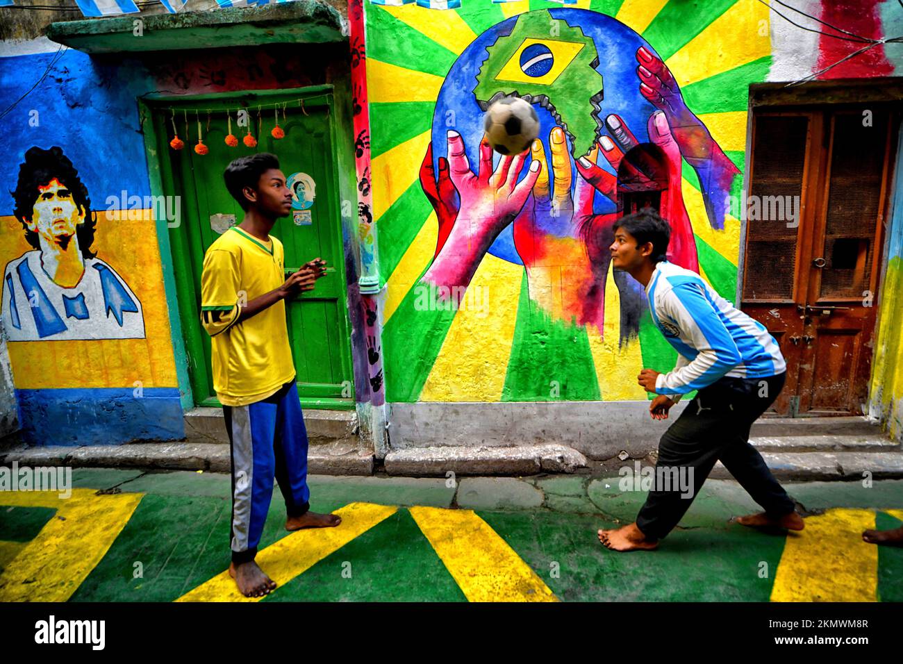 Members of Dishari club seen playing football in front of street art ...