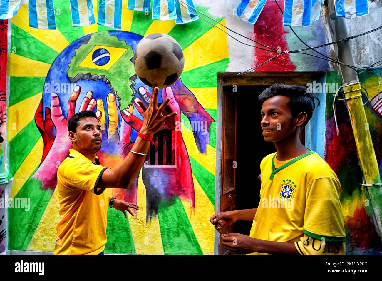 Members of Dishari club seen playing with a football in front of street ...