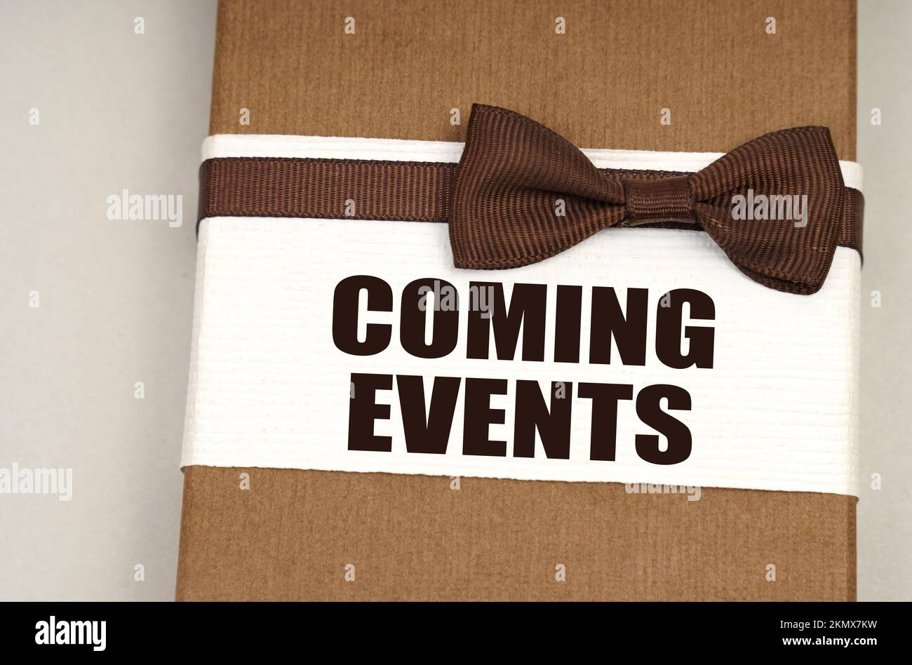 Finance and business concept. On the packing box with a bow-tie the inscription - Coming Events ...