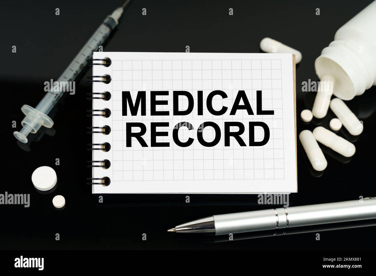 Medicine and healthcare concept. On the black surface are pills, a ...