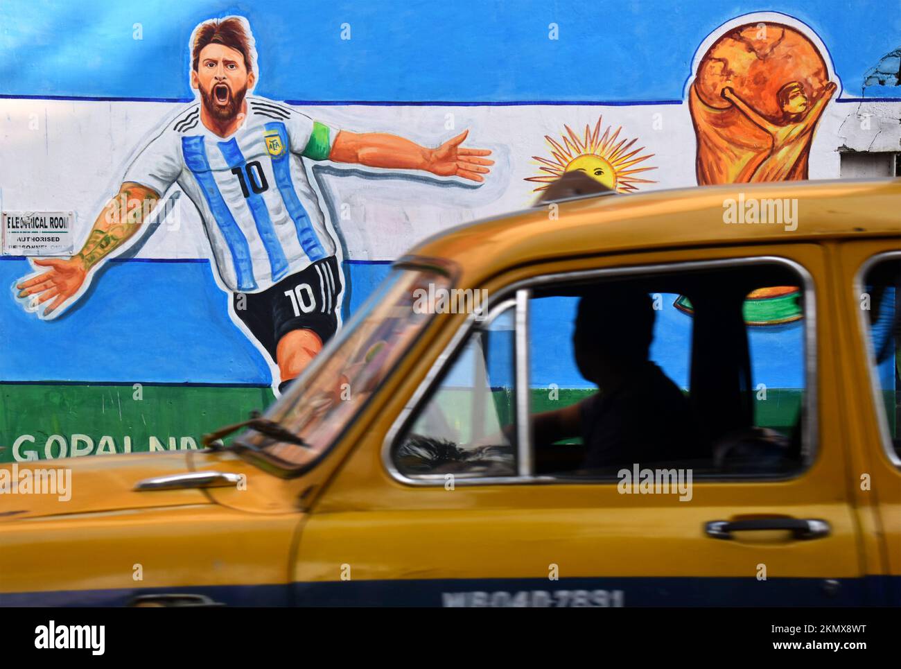 Kolkata, West Bengal, India. 26th Nov, 2022. A yellow taxi passes next ...