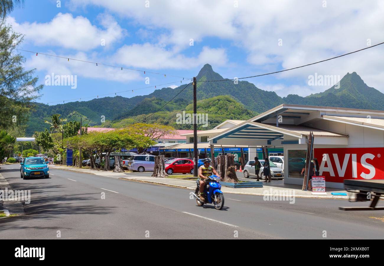 The main road through the town of Avarua on the island of Rarotonga ...