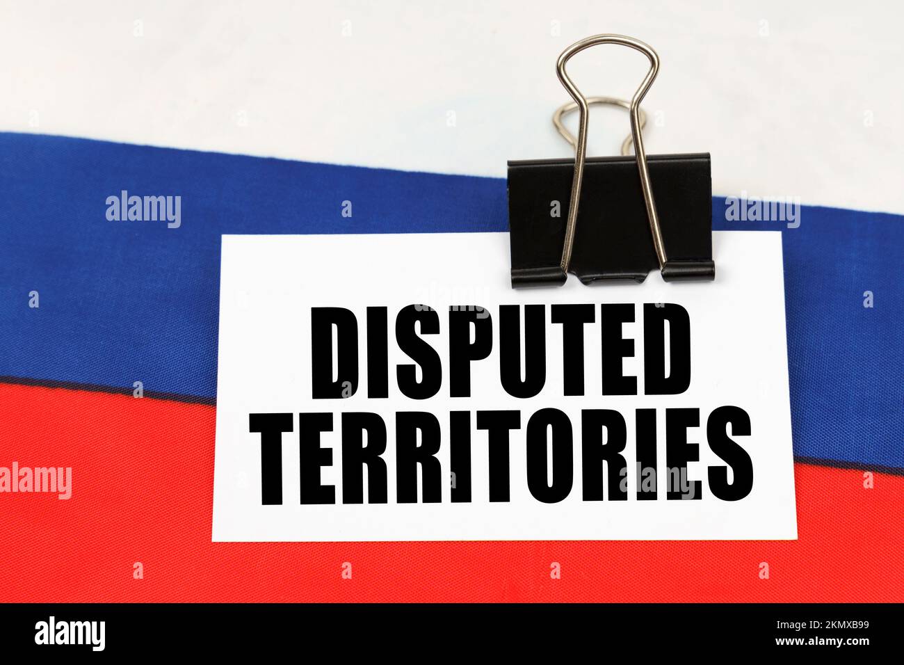 National concept. On the flag of Russia there is a business card with ...