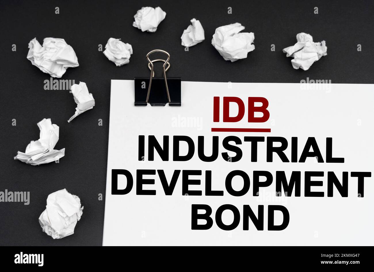 Industrial concept. On a black background, there are crumpled pieces of ...