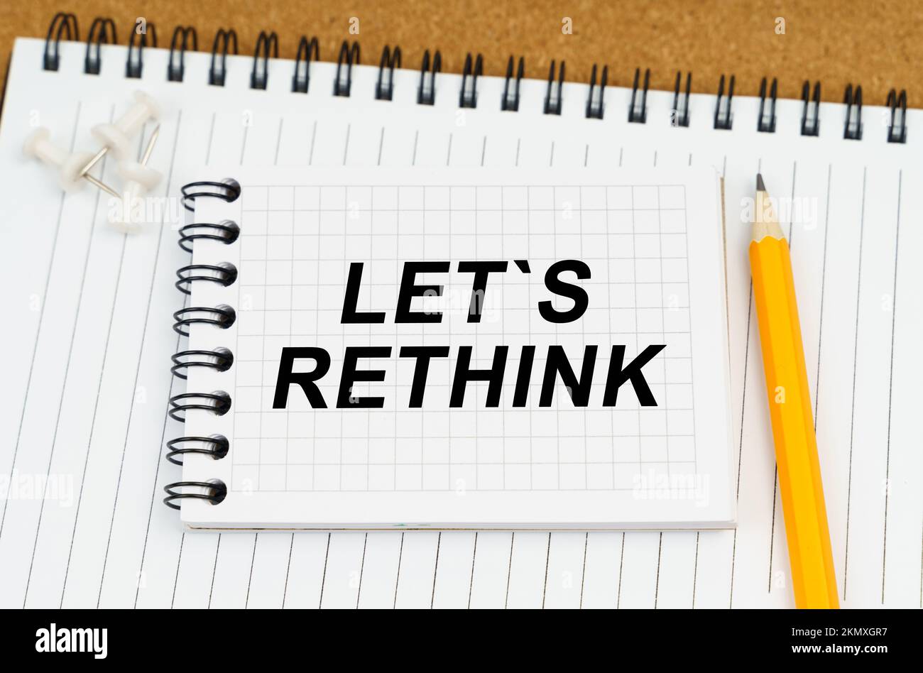 Business and economy concept. There are two notebooks and a pencil on ...