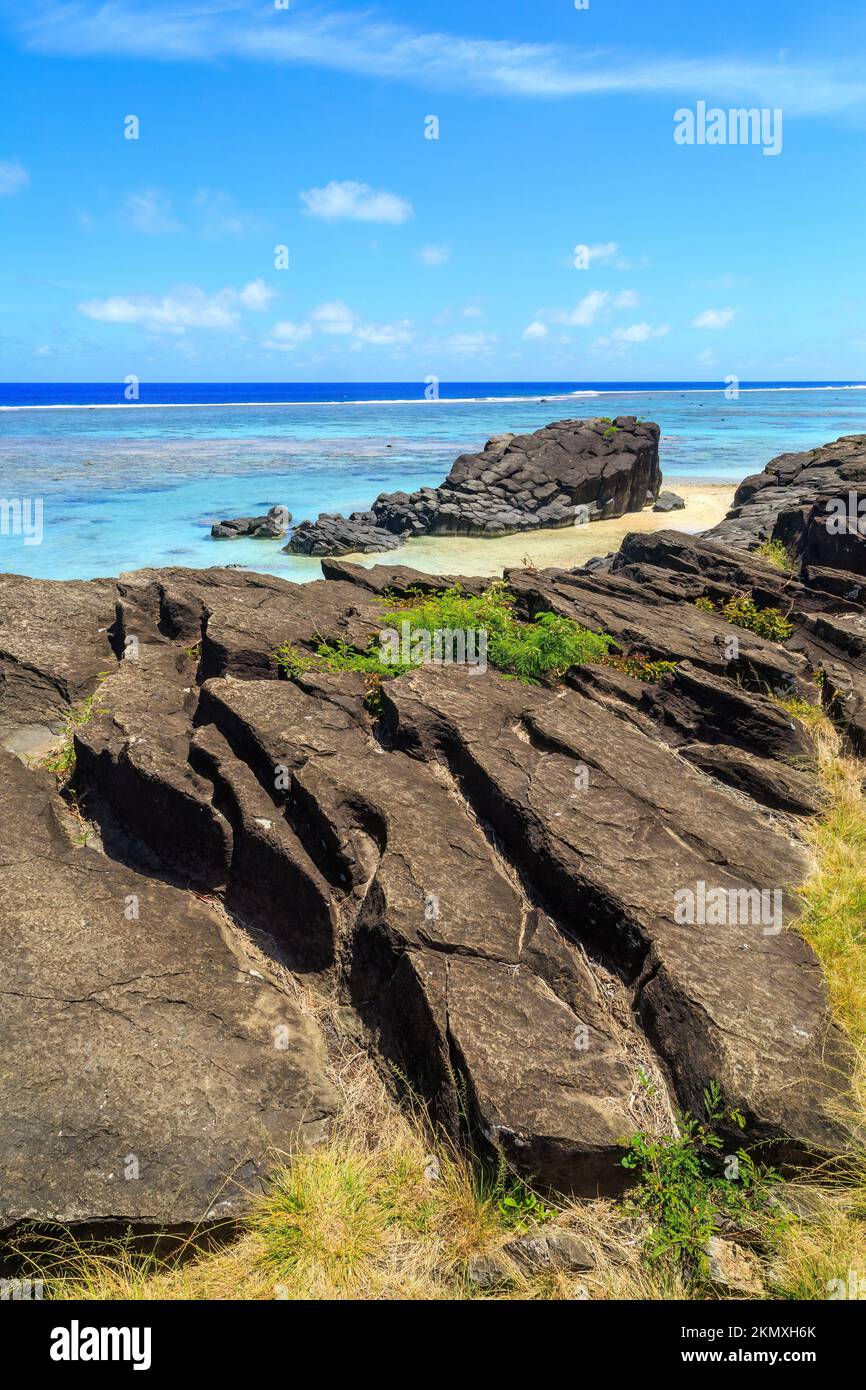 The Black Rock, a distinctive formation of volcanic basalt on a beach ...
