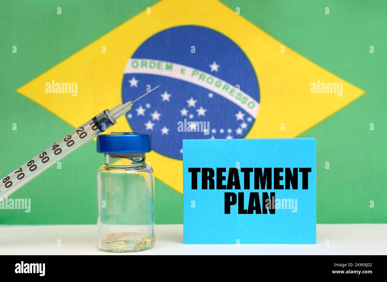 Medicine concept. Vaccine, syringe and blue plate with the inscription ...