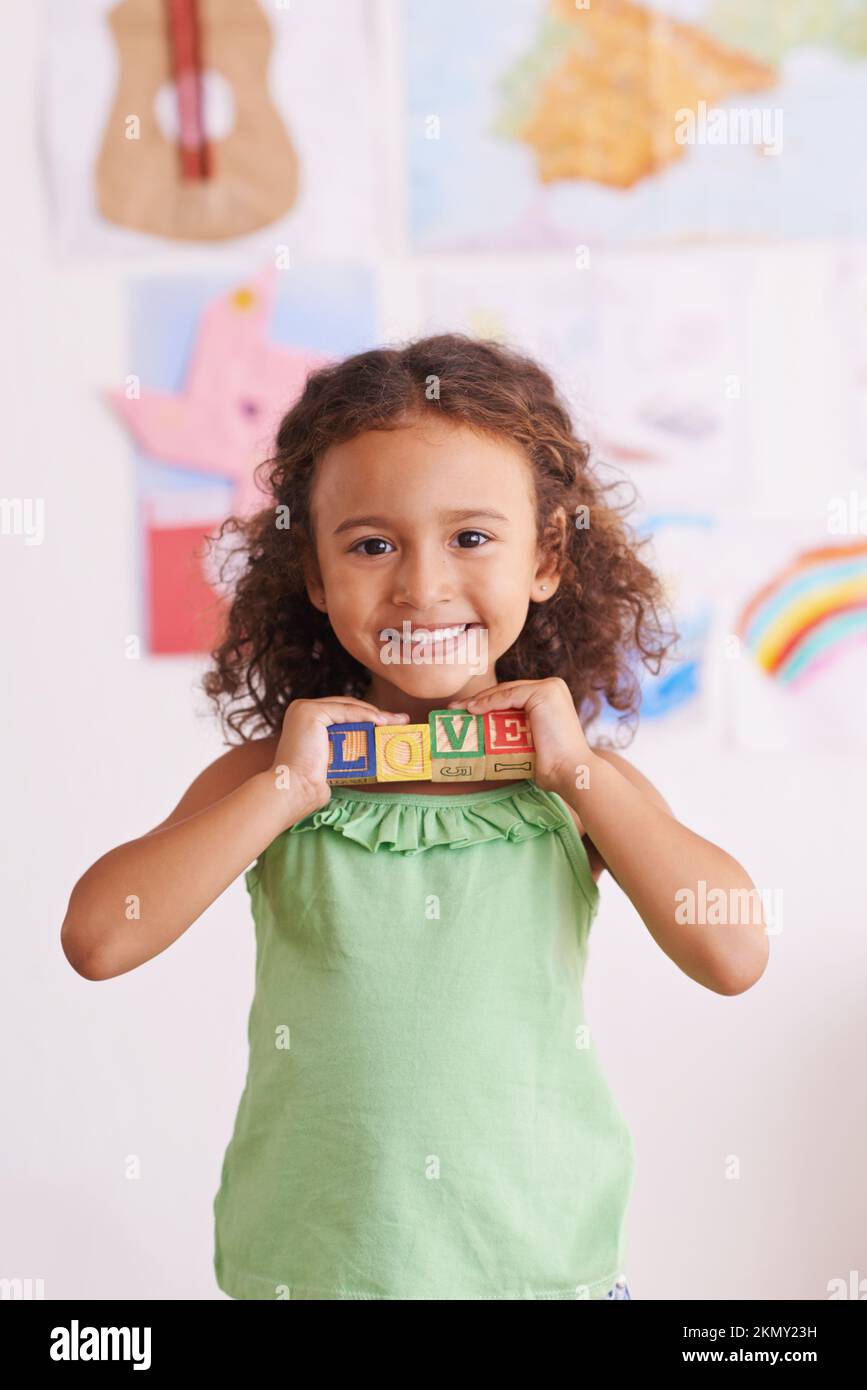 Who doesnt love alphebet blocks. a cute little girl playing with ...