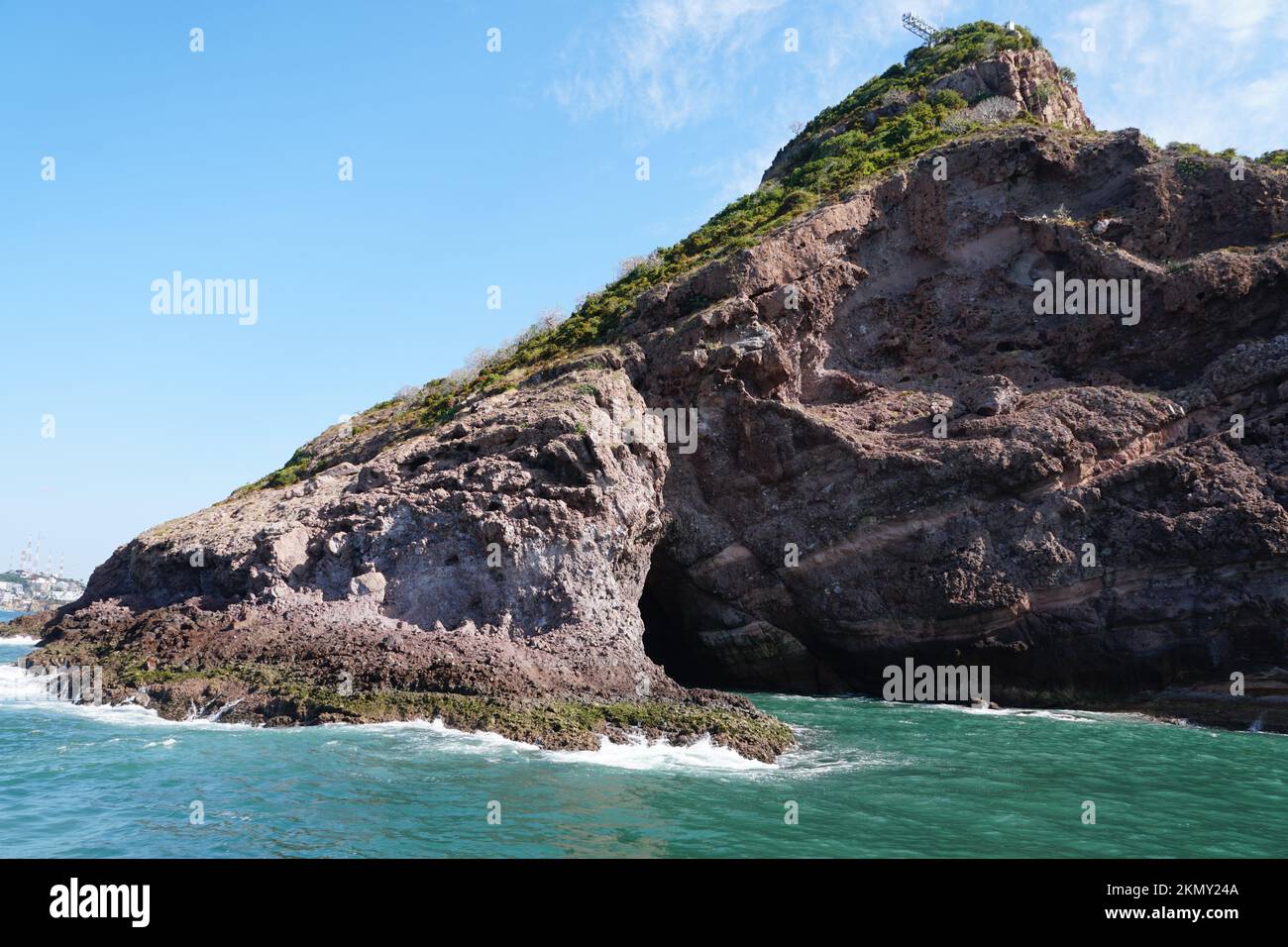 The side view of Caverna del Diablo, a dark little cave near Mazatlan ...