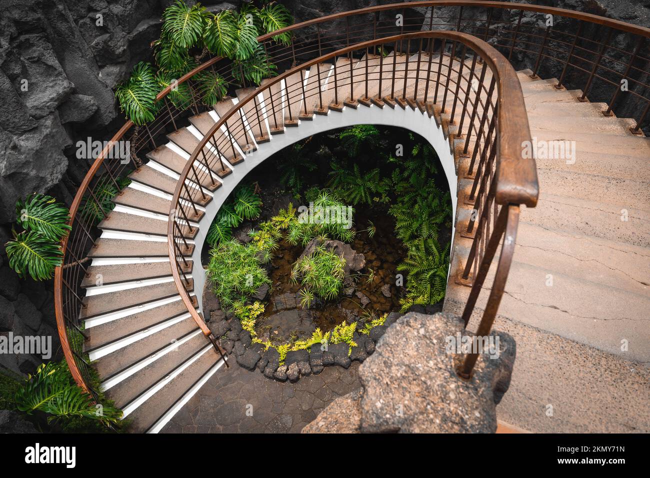 A top view of Spiral staircase leading down into a lava cave at Museo ...