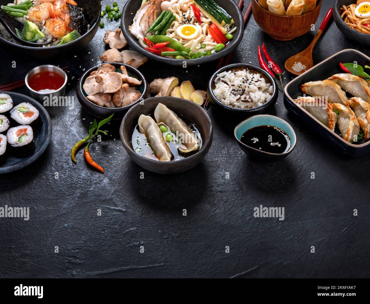 Traditional Asian food. Various of asian meals on dark background ...