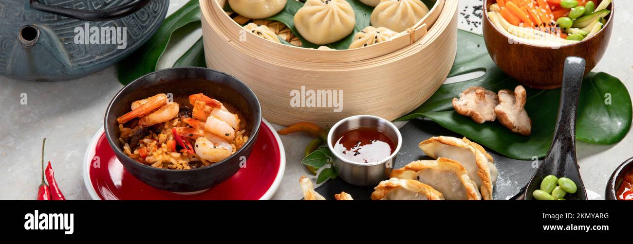 Assorted Chinese food on dark background. Chinese cuisine dishes on ...