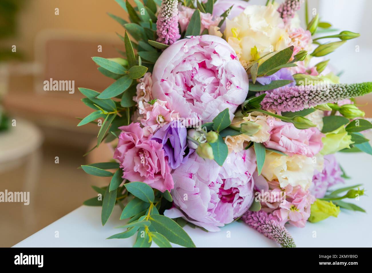 Rich bunch of pink peonies and lilac eustoma roses flowers, green leaf ...
