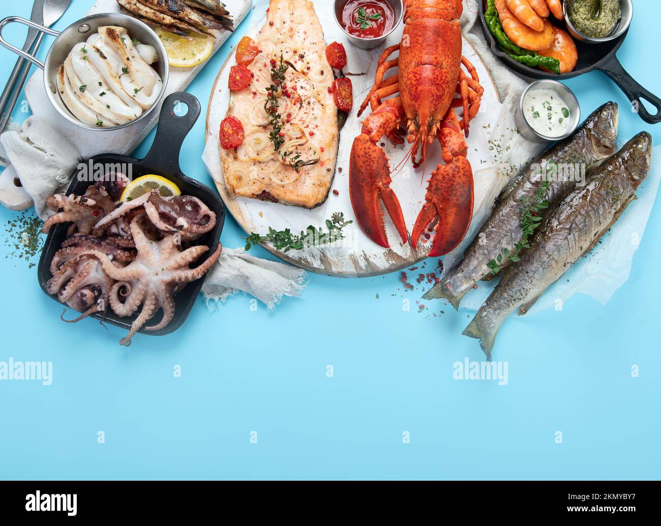 Various seafood and fishes dishes. Healthy food concept on blue ...