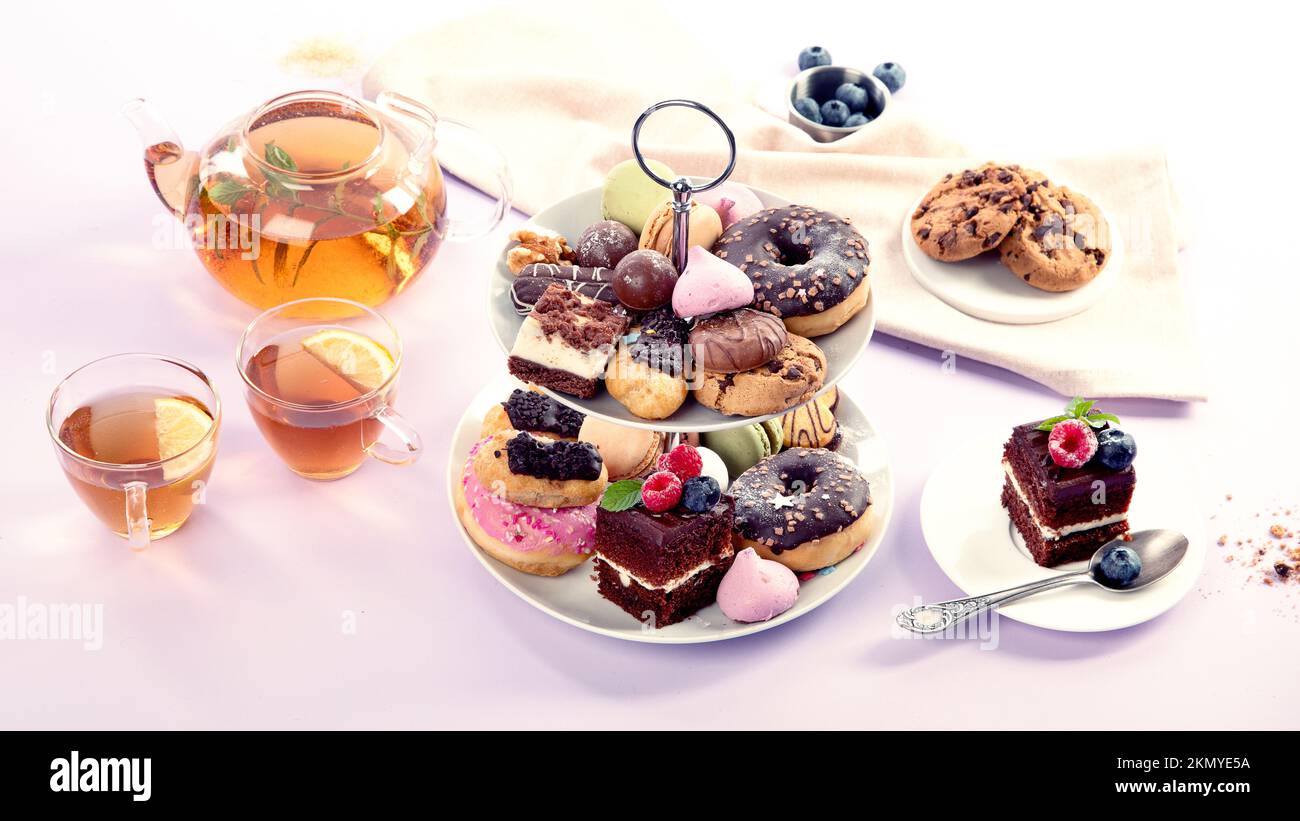 Traditional English tea. Afternoon tea with selection of sweets on ...