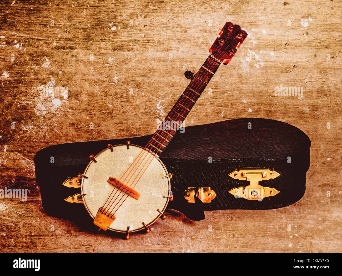 Still life art of a vintage score with banjo guitar and case in barn ...