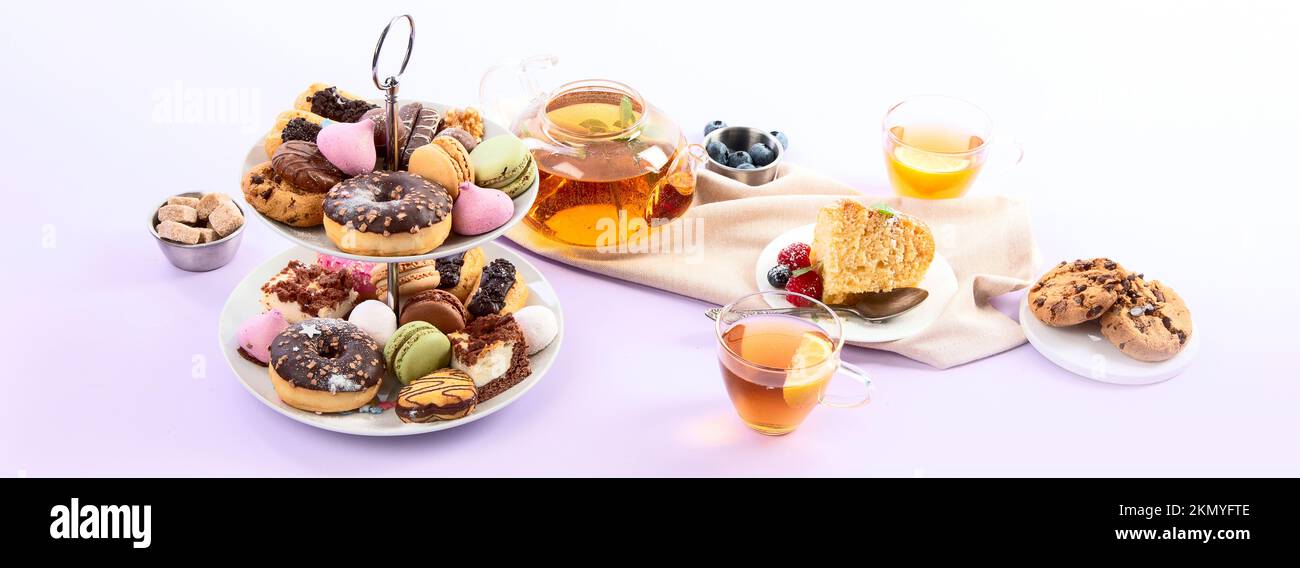Traditional English tea. Afternoon tea with selection of sweets on ...
