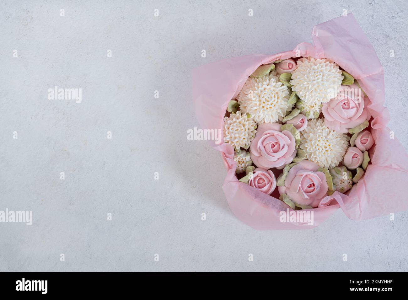 Zephyr bouquet of flowers in a gift box on a light background, top view ...