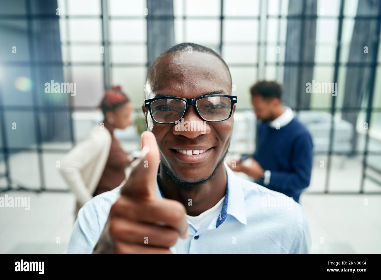 Man pointing up smiling hi-res stock photography and images - Alamy