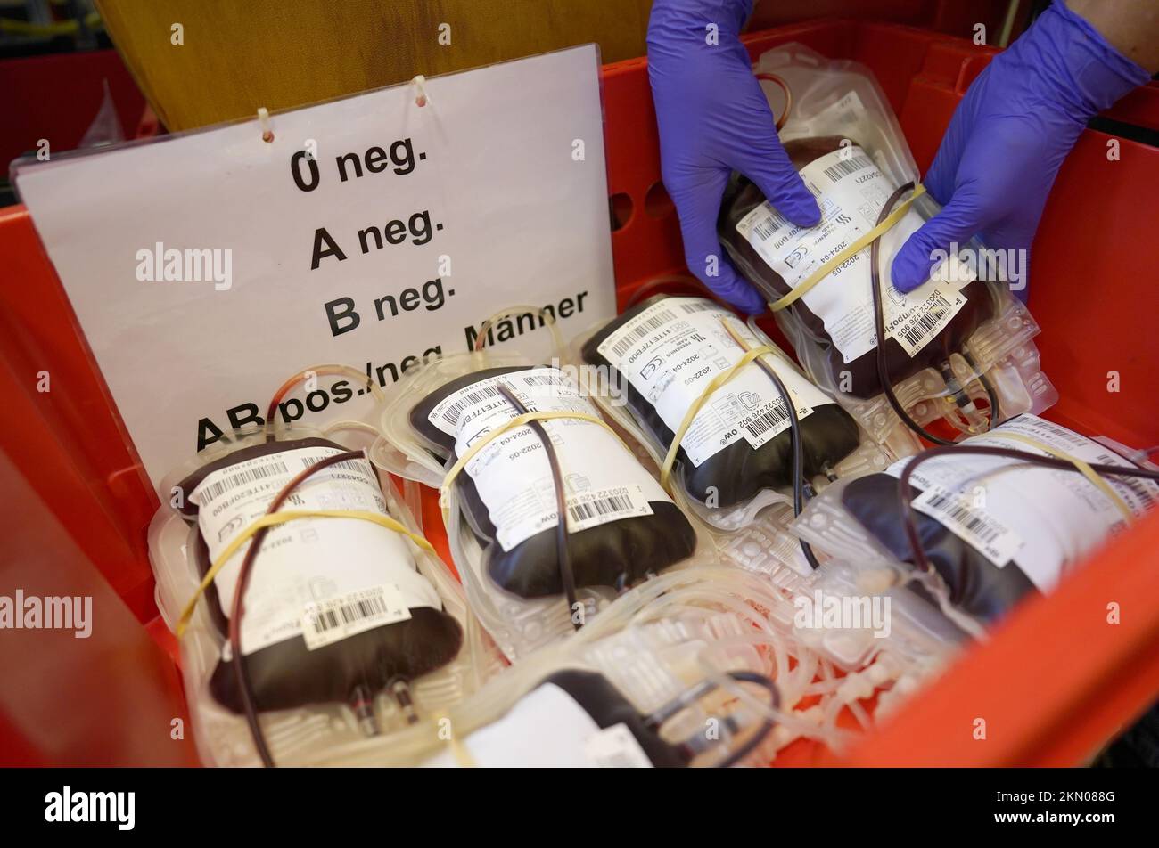 Kaltenkirchen, Germany. 25th Nov, 2022. An employee of the German Red ...
