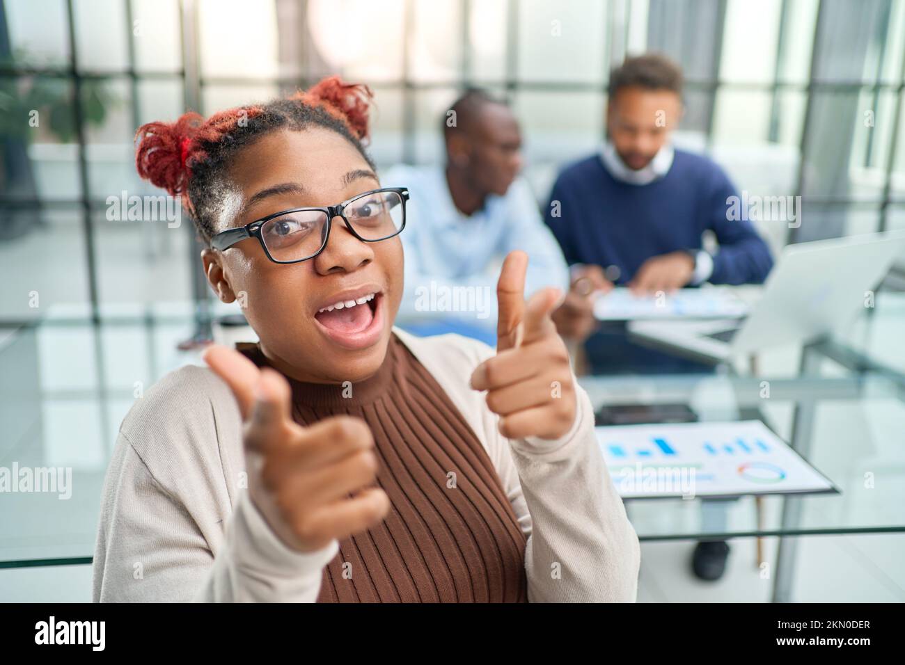 business woman sitting near the office desk and pointing at you Stock ...