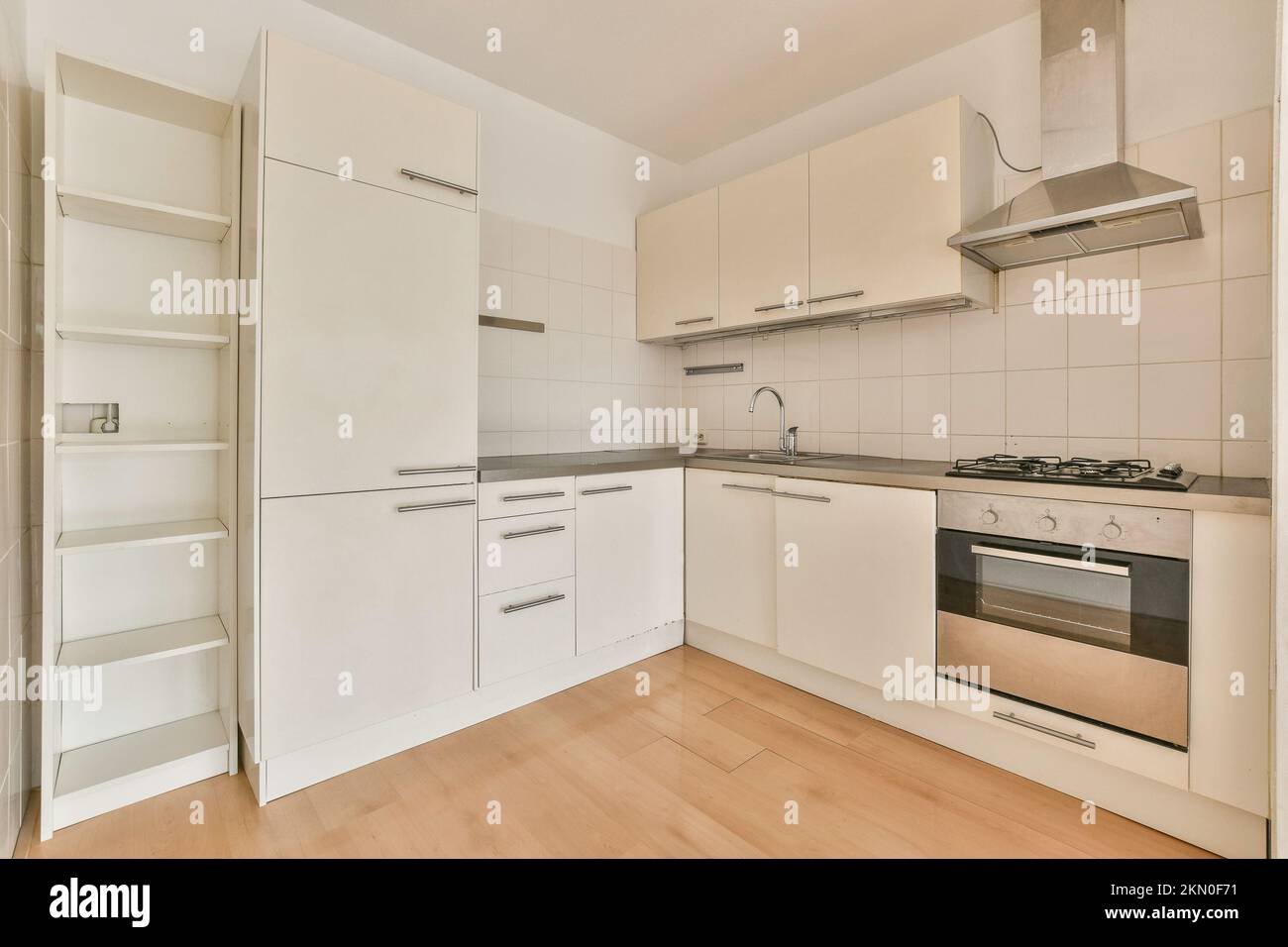 Interior of white kitchen with windows and wooden parquet floor Stock ...