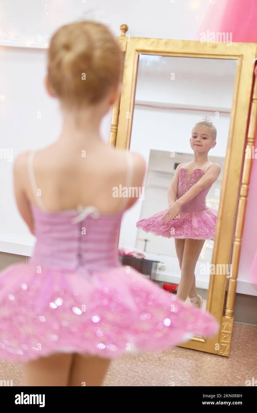 Little ballerina training. Children dance сlassical ballet in studio ...