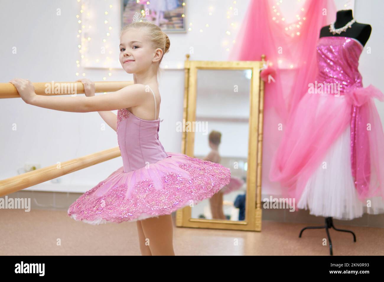 Little ballerina training. Children dance сlassical ballet in studio ...