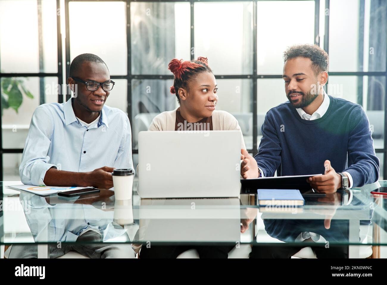 business team works sitting at the office desk Stock Photo - Alamy