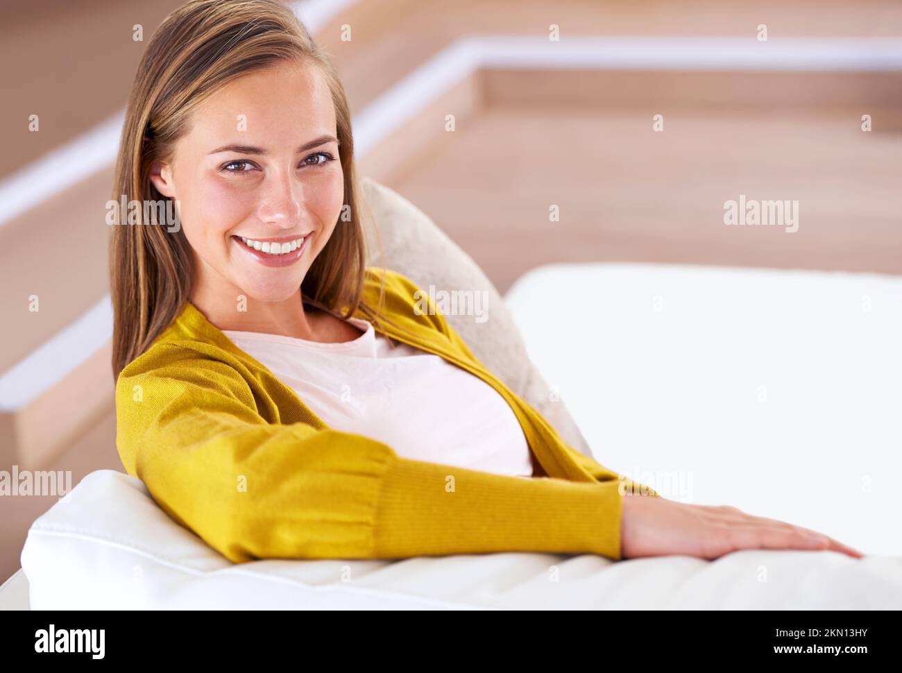 Feeling relaxed. Portrait of an attractive young woman relaxing at home ...