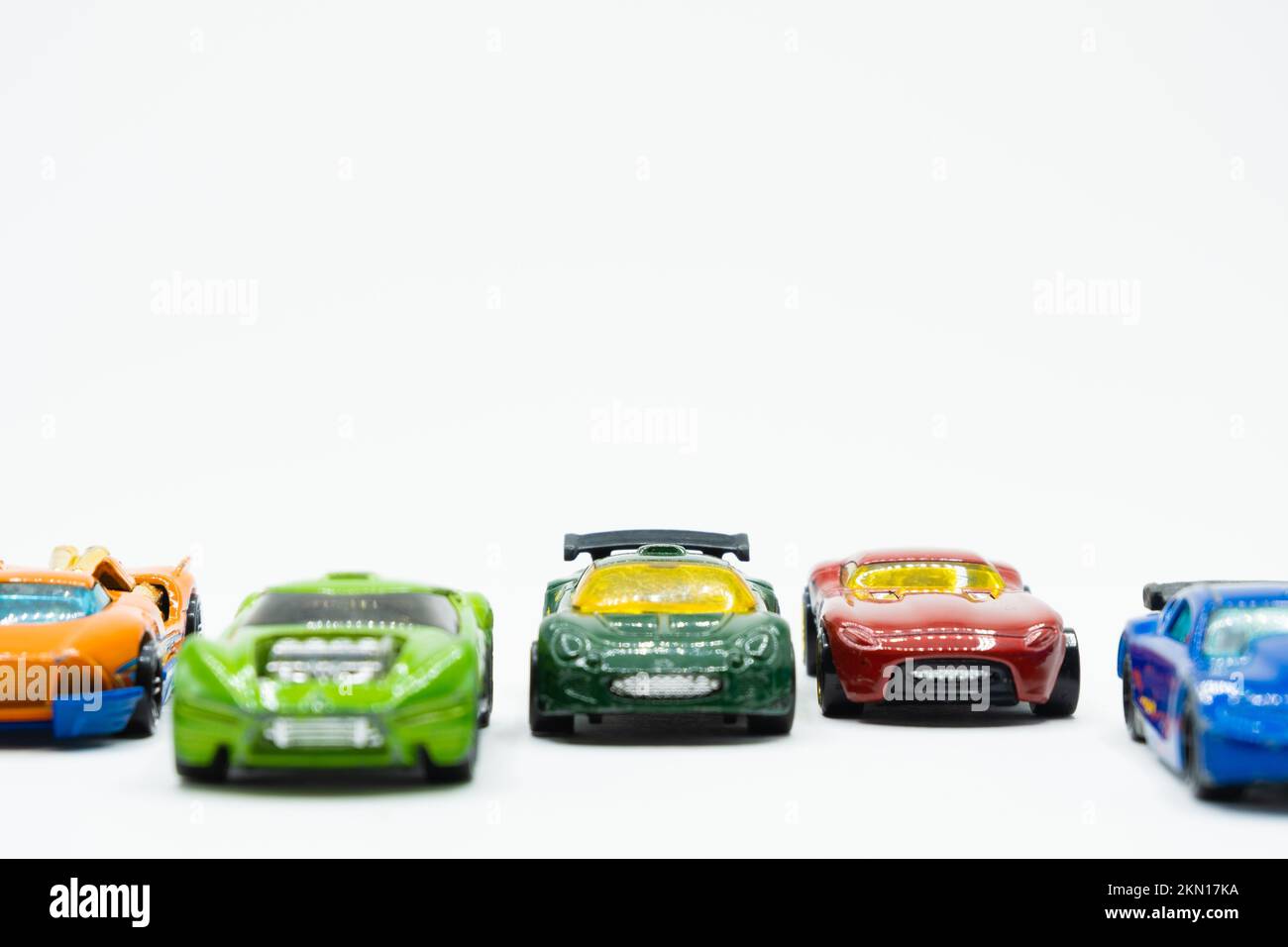 Collection of race car toys on white background Stock Photo - Alamy