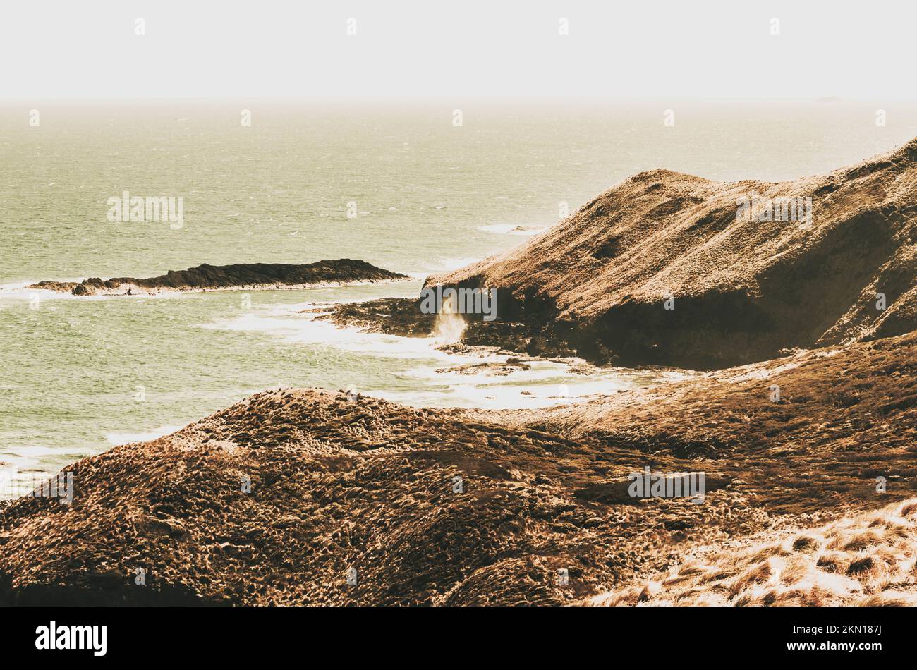 Vintage stylised landscape photography on an old rocky cape in rugged ...