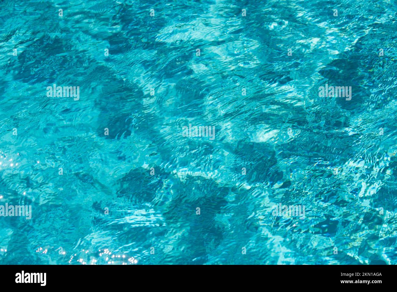 Abstract ripple wave and clear turquoise water surface in swimming pool ...