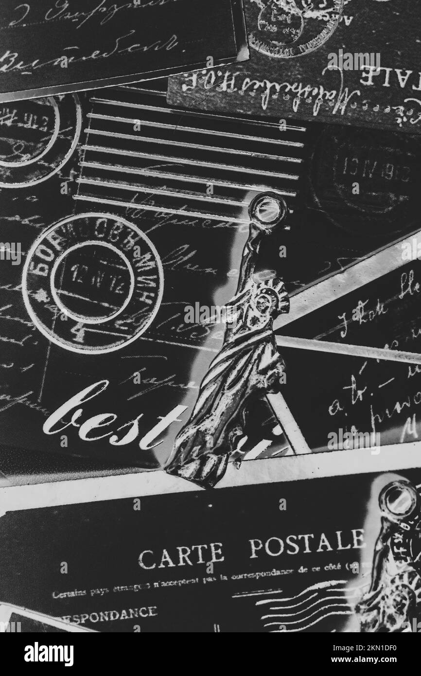Historic travel mementos with old postage insignia and inverse statue ...